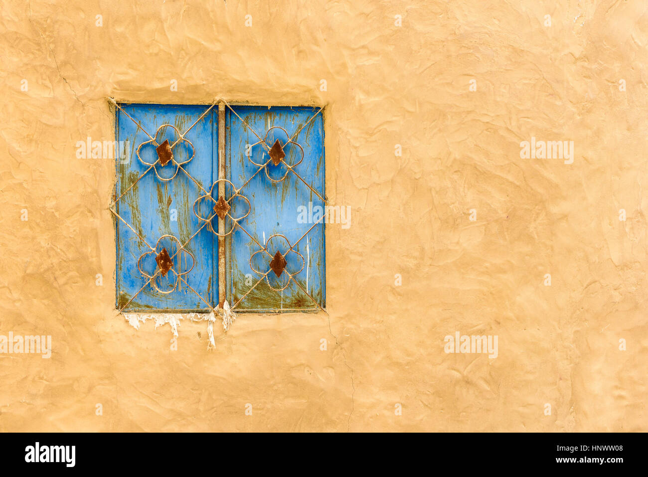 Shuttered window on a sand colored arabic building Stock Photo - Alamy