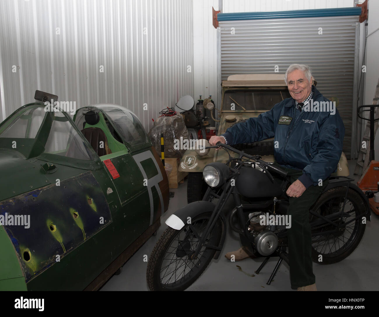 Robin Brooks poses with a motorbike , aircraft and Volkswagen ...