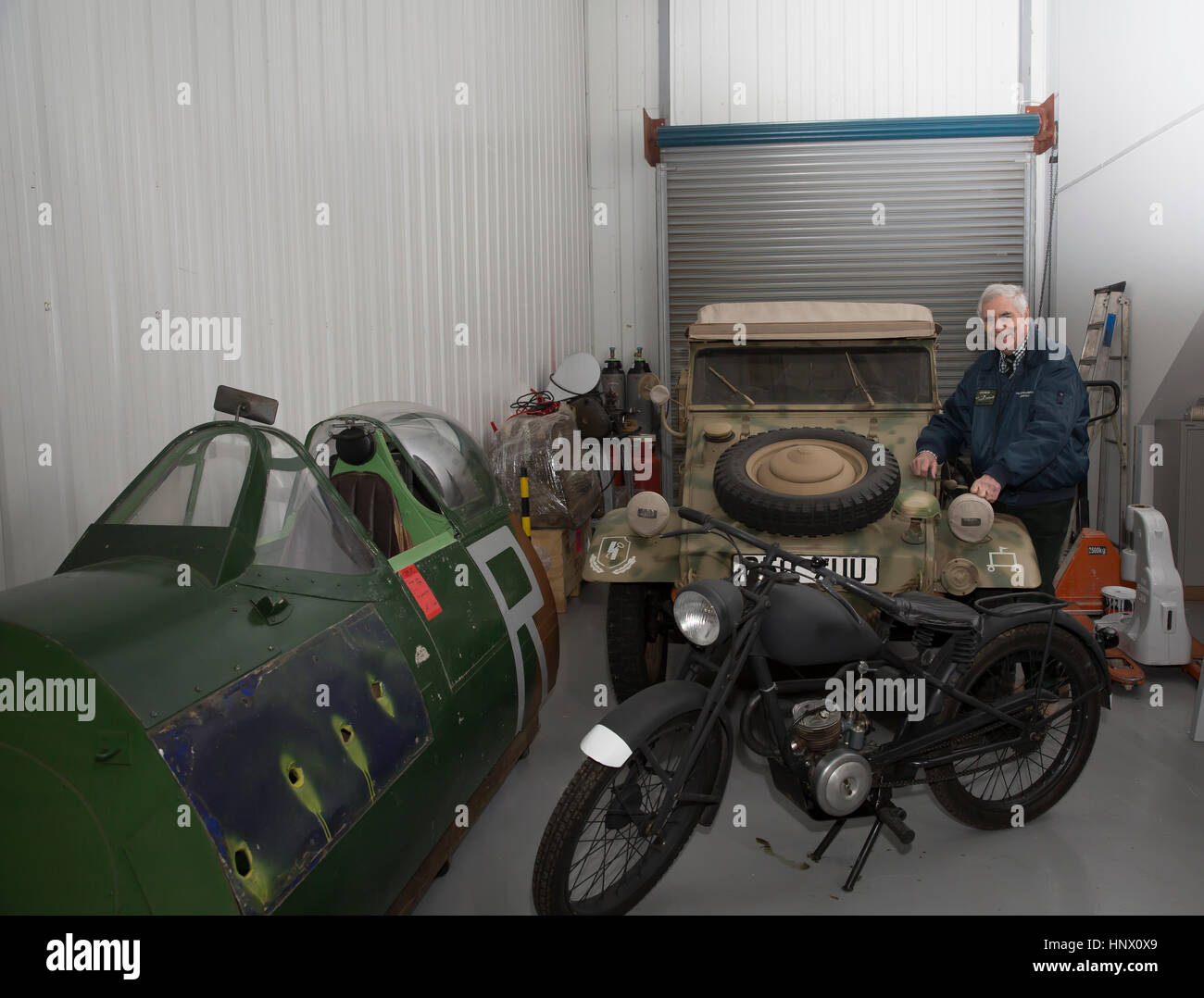 Robin Brooks poses with a motorbike , aircraft and Volkswagen ...