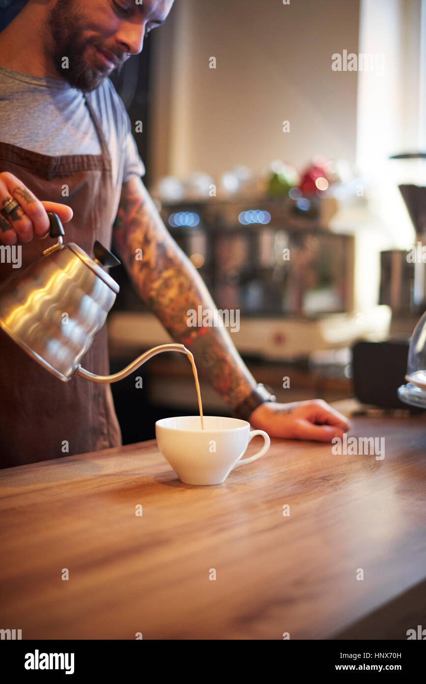 Barista making coffee Stock Photo - Alamy