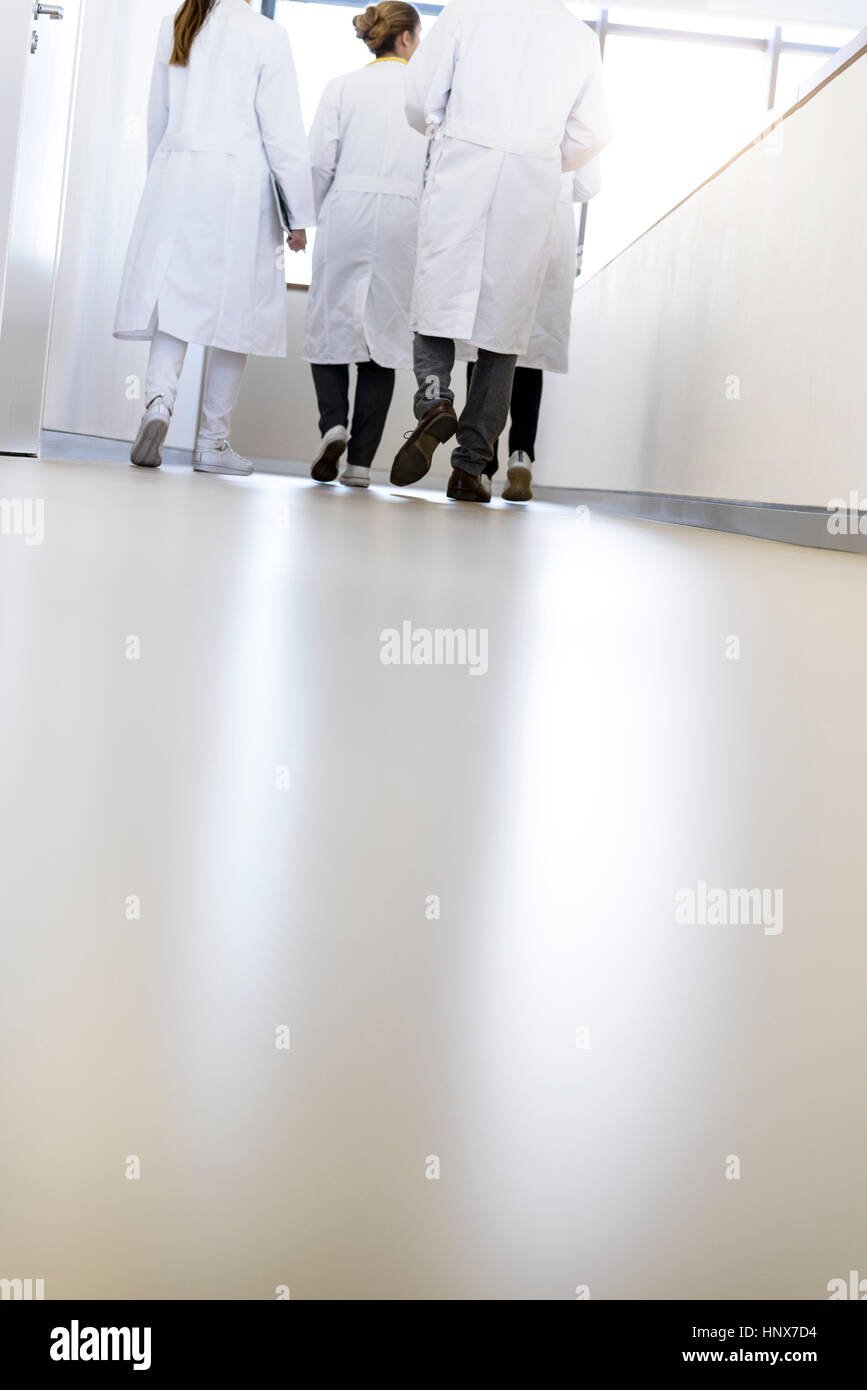 Doctor walking rear hi-res stock photography and images - Alamy