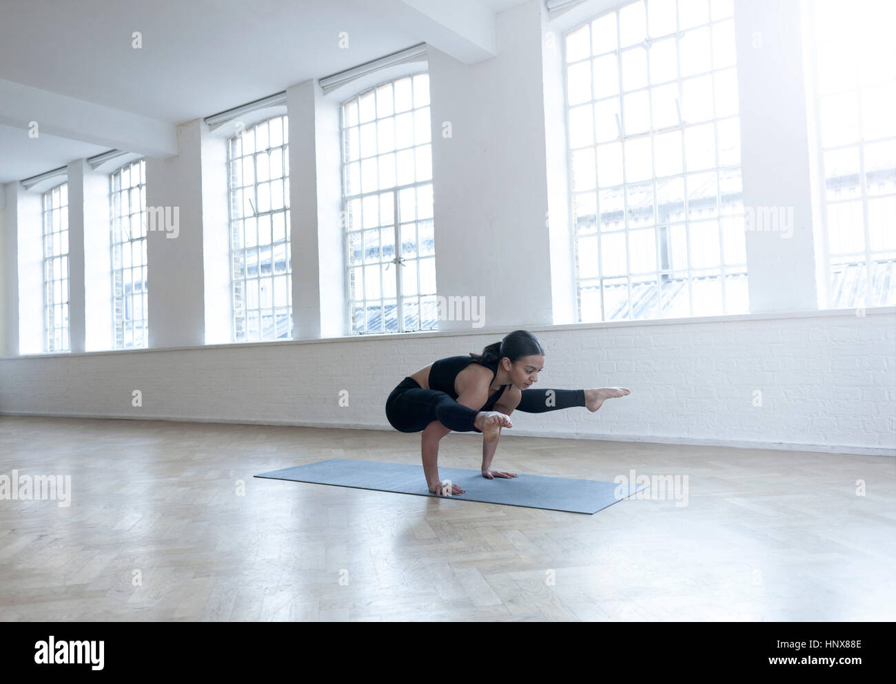 Woman yoga in light studio hi-res stock photography and images - Alamy