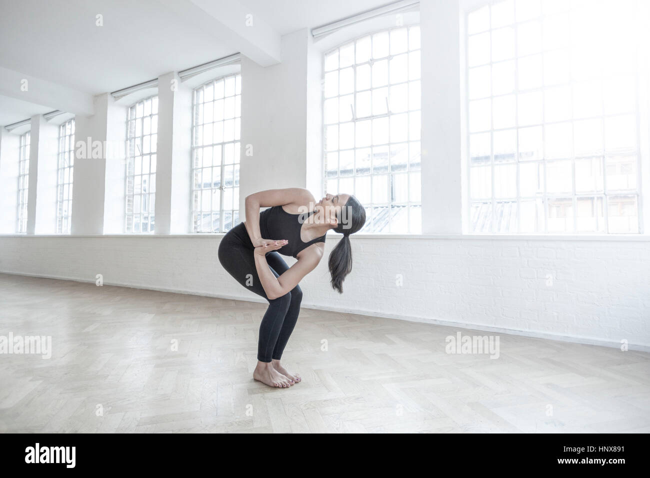 Woman yoga in light studio hi-res stock photography and images - Alamy