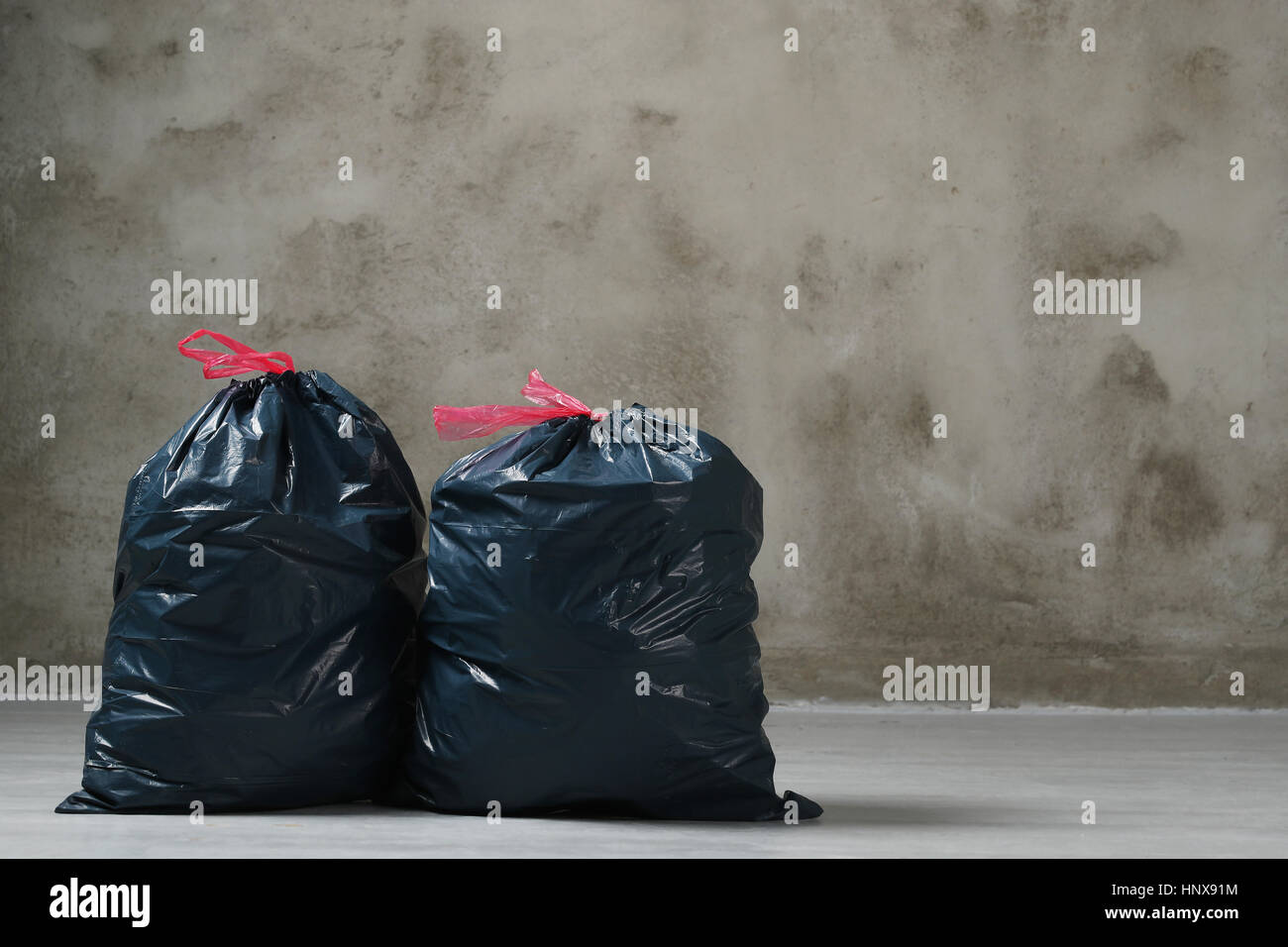 Pollution. Trash bags on the floor Stock Photo - Alamy