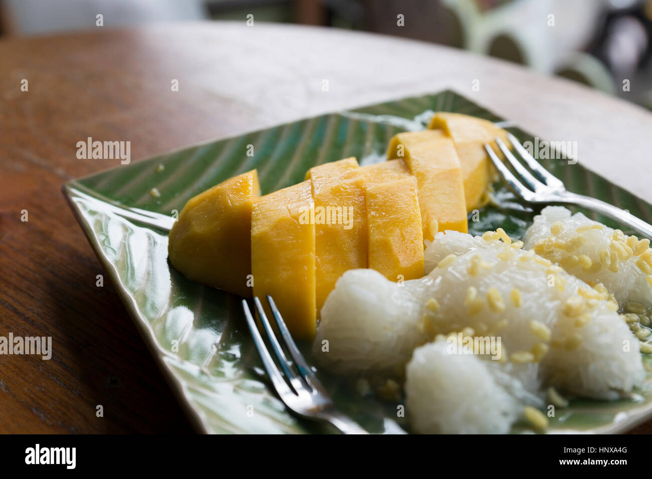 ripe mango with sticky rice topping with coconut milk and nut Stock ...