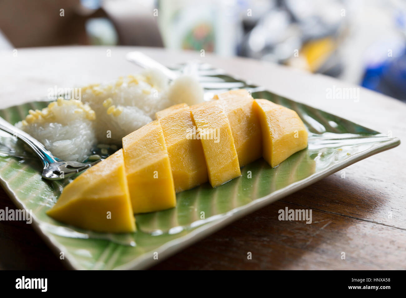 ripe mango with sticky rice topping with coconut milk and nut Stock ...