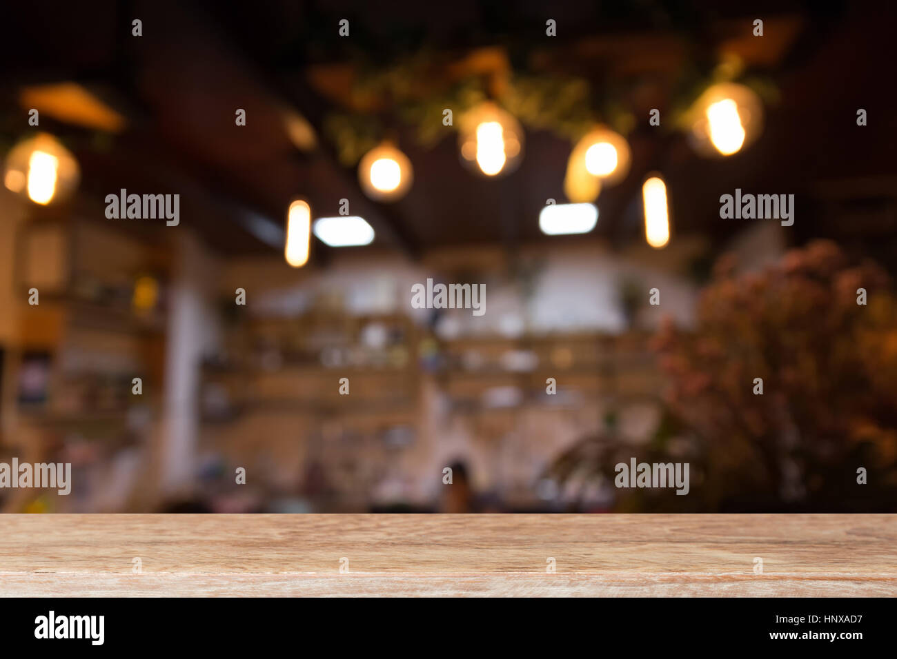 wood table with beverage counter at coffee shop restaurant (blur ...