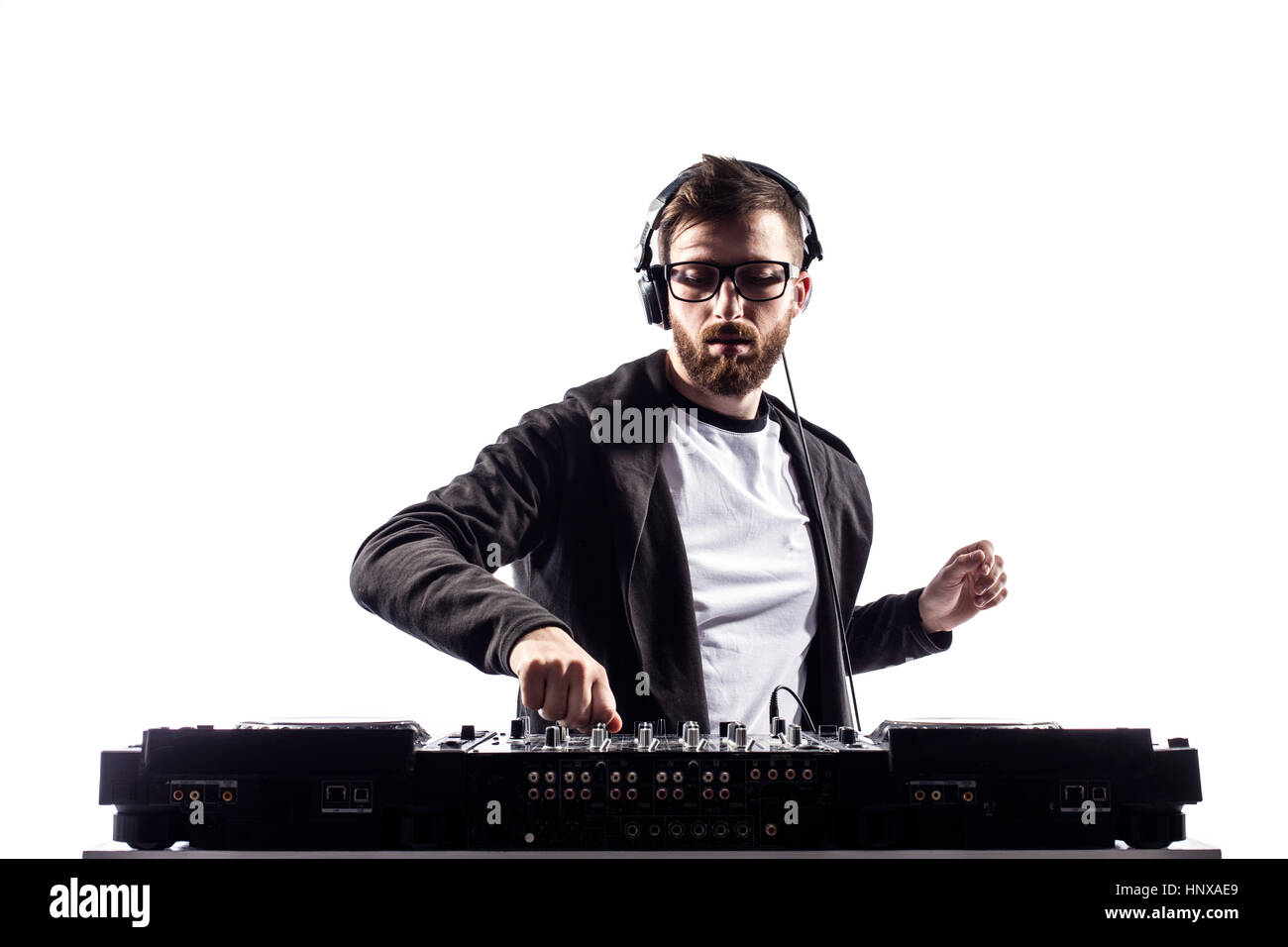 Trendy male dj posing against mixing console Stock Photo - Alamy