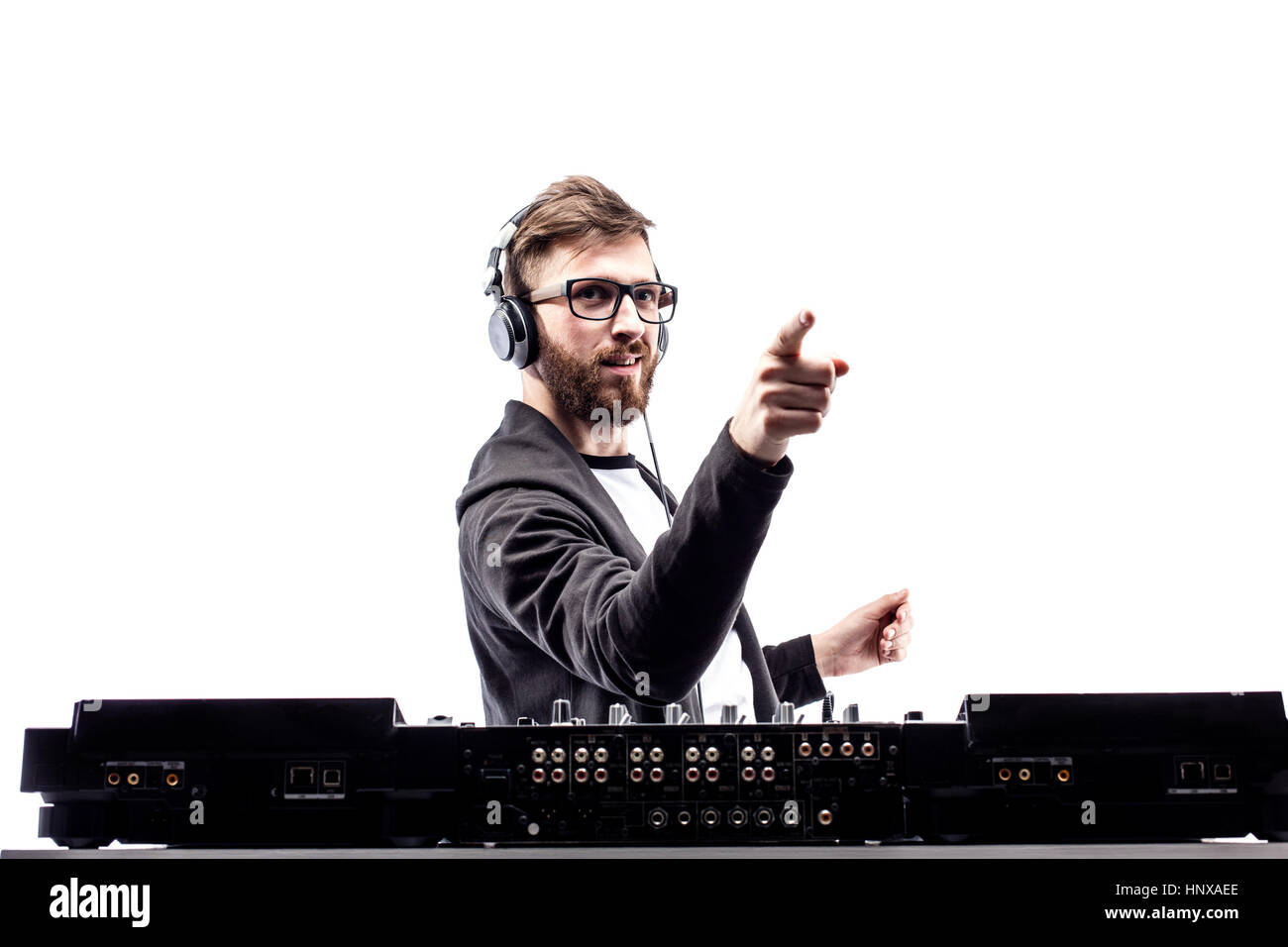Trendy male dj posing against mixing console Stock Photo - Alamy