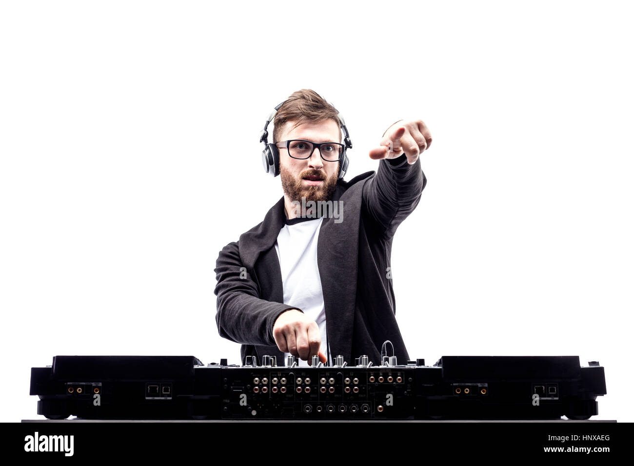 Trendy male dj posing against mixing console Stock Photo - Alamy