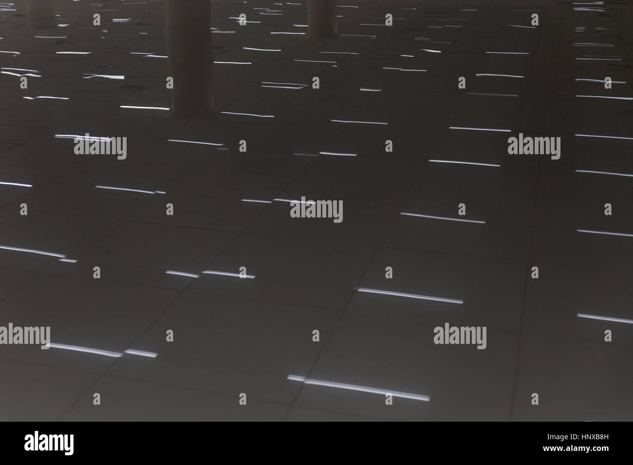 abstract background of reflection of fluorescent light bulb on tile ...