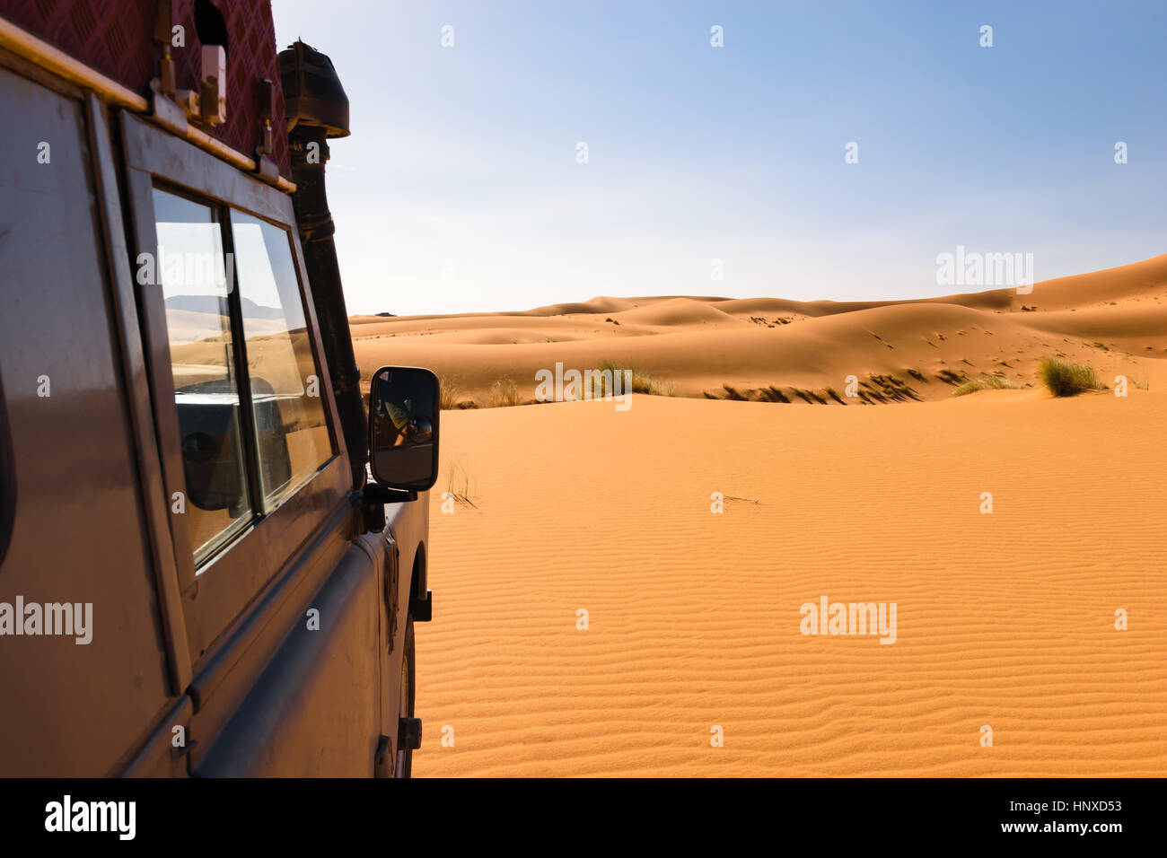 Off- road vehicle oldtimer in Sahara dunes, Morocco Stock Photo - Alamy
