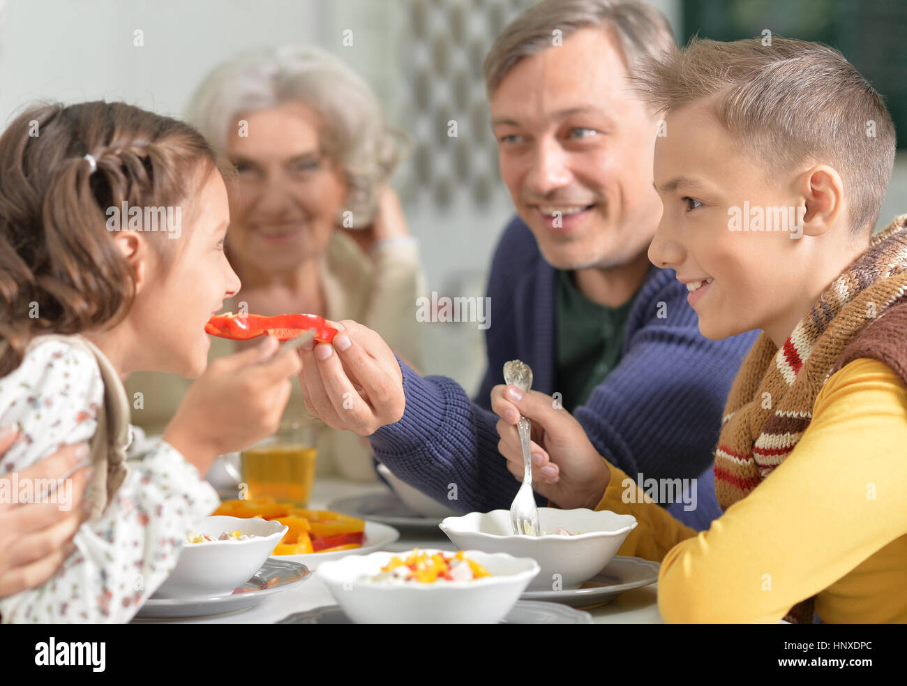 family eating dinner Stock Photo - Alamy
