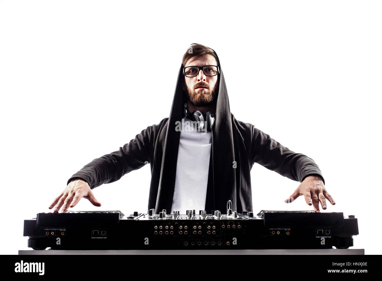 Trendy male dj posing against mixing console Stock Photo - Alamy