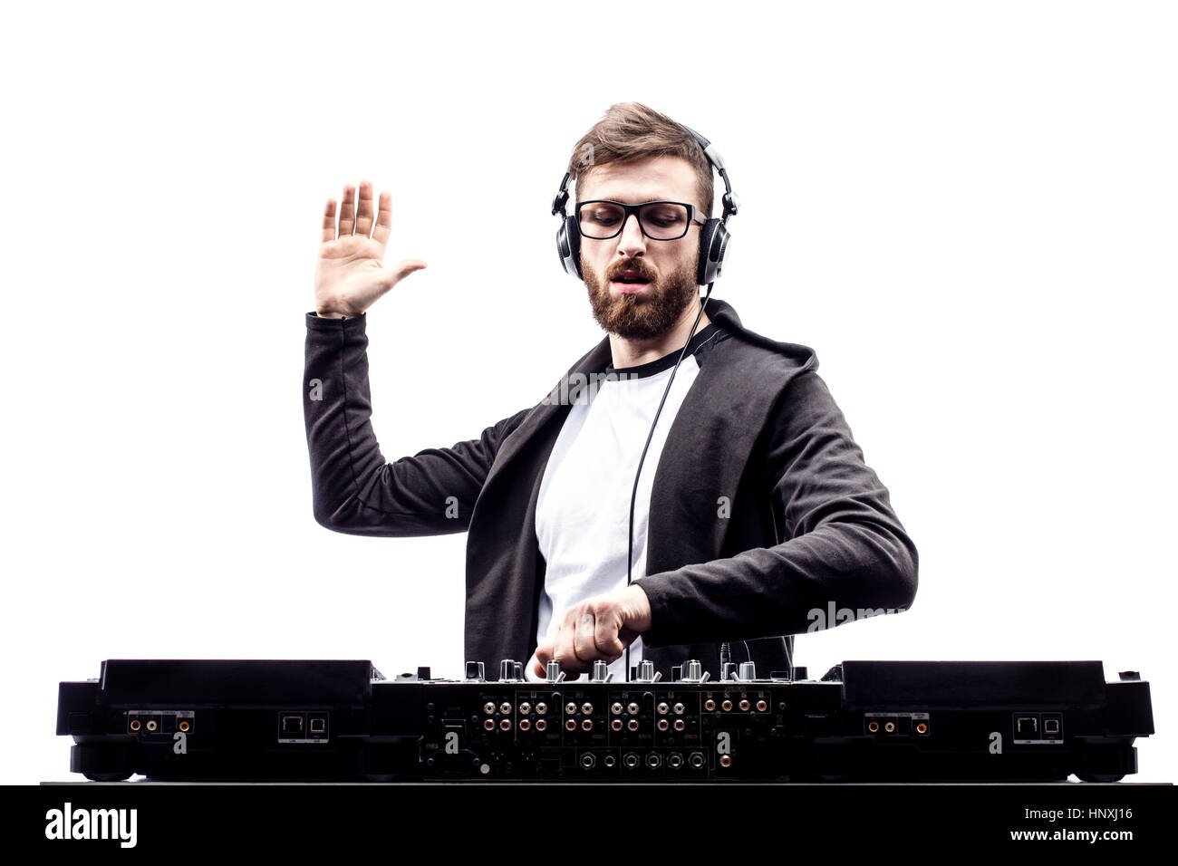 Trendy male dj posing against mixing console Stock Photo - Alamy
