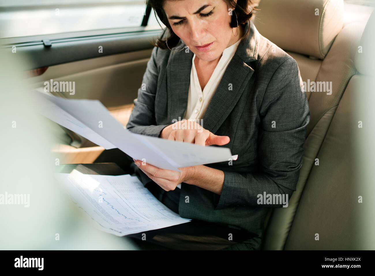 Businesswoman Busy Working Car Inside Stock Photo - Alamy