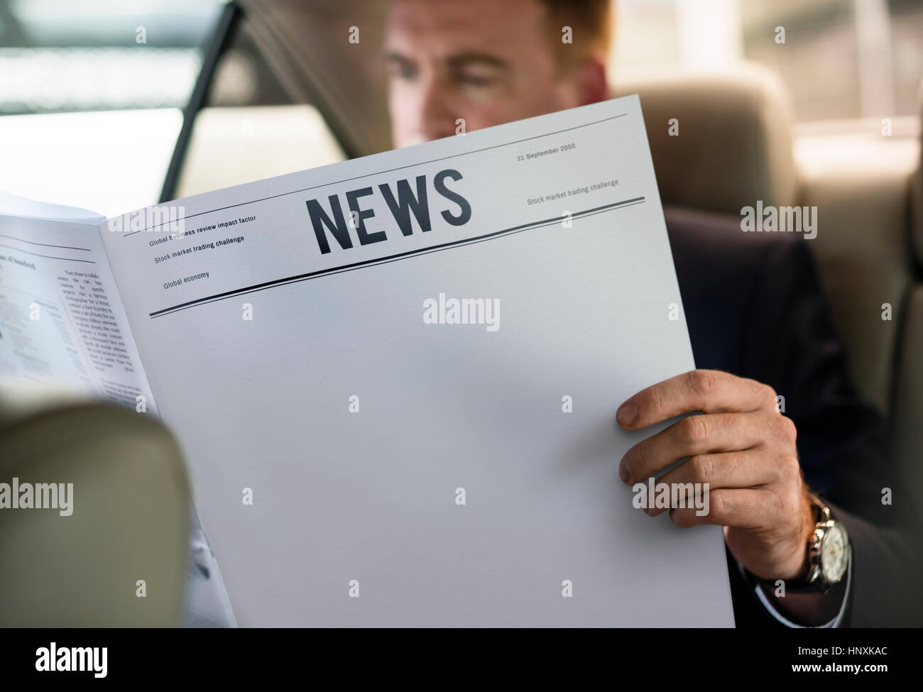 Businessman Reading Newspaper Car Inside Stock Photo - Alamy