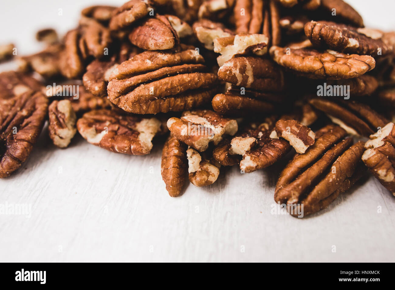 walnut half heap on white background Stock Photo - Alamy