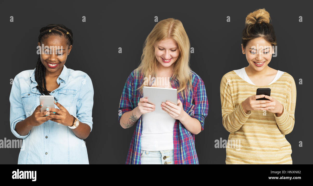 Friends Using Tablet Technology Phone Stock Photo - Alamy
