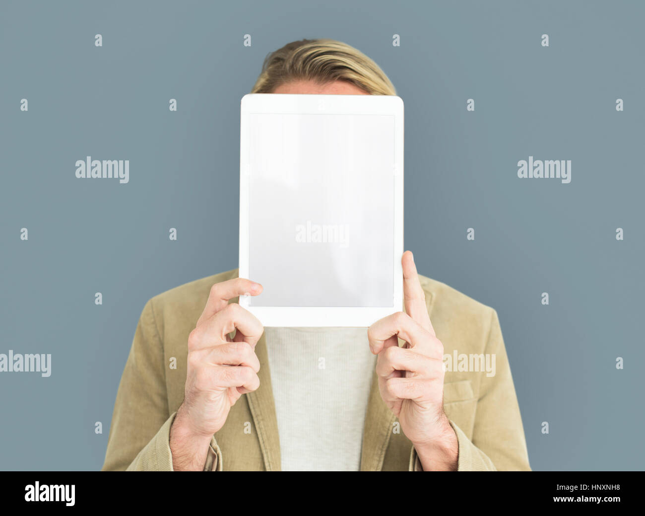 Man Holding Up Tablet Covering Face Stock Photo - Alamy