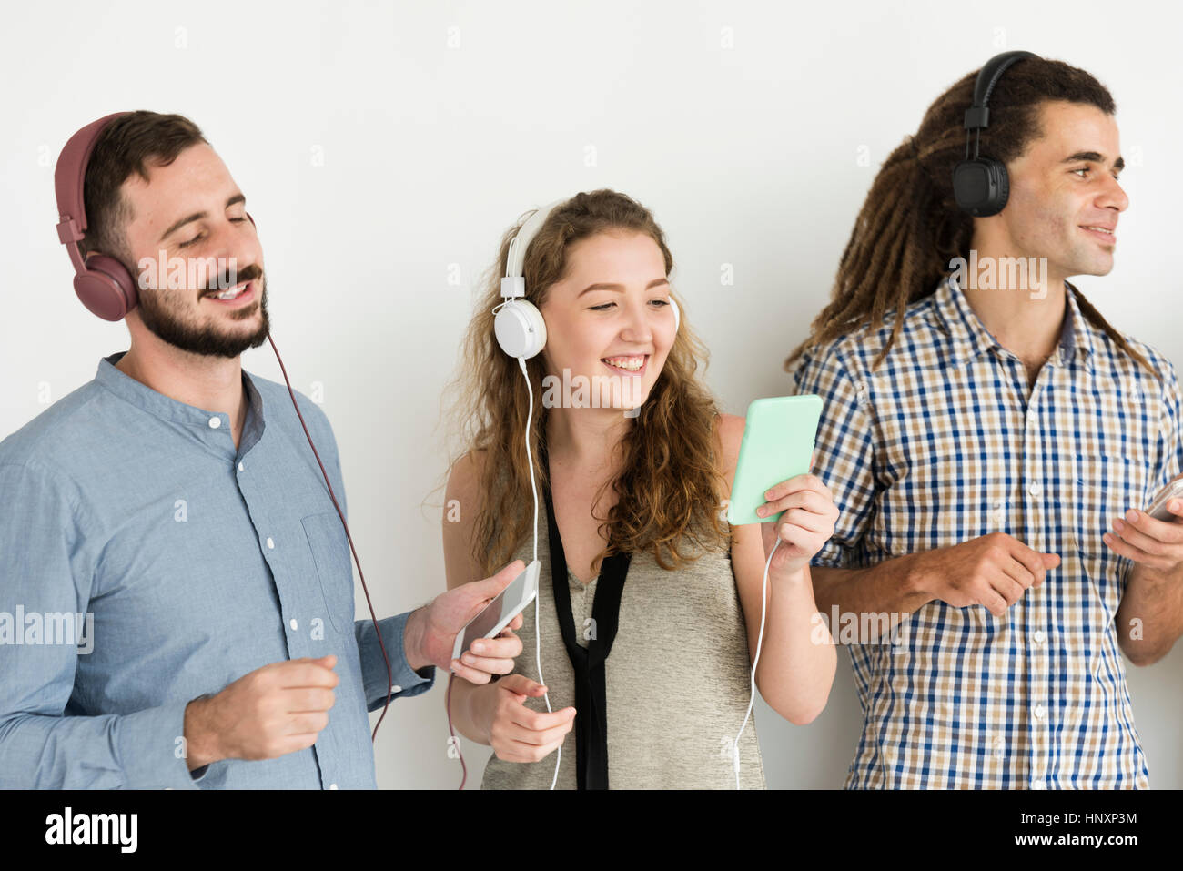 Group of friends listening to music Stock Photo - Alamy