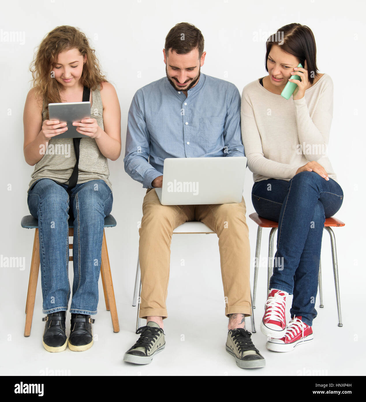 Group of people using digital devices Stock Photo - Alamy