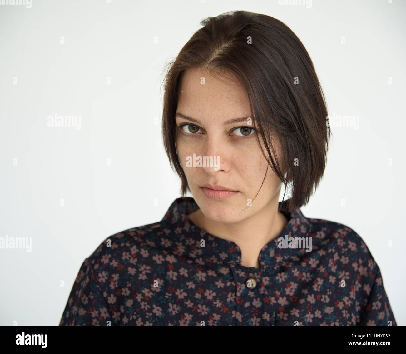 Brunette woman with an angry face Stock Photo - Alamy