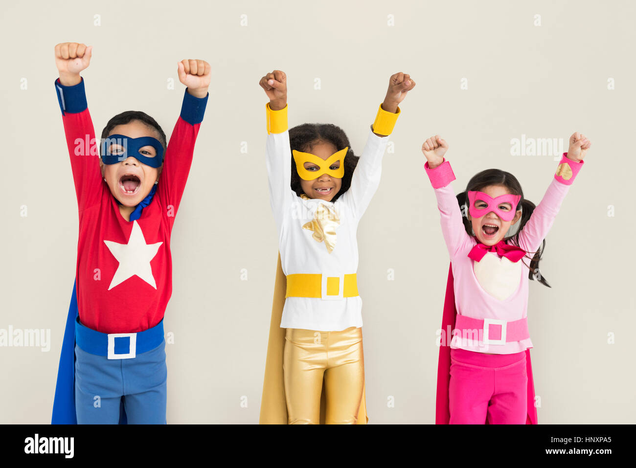 Superhero Kids Hands Up Flying Concept Stock Photo - Alamy