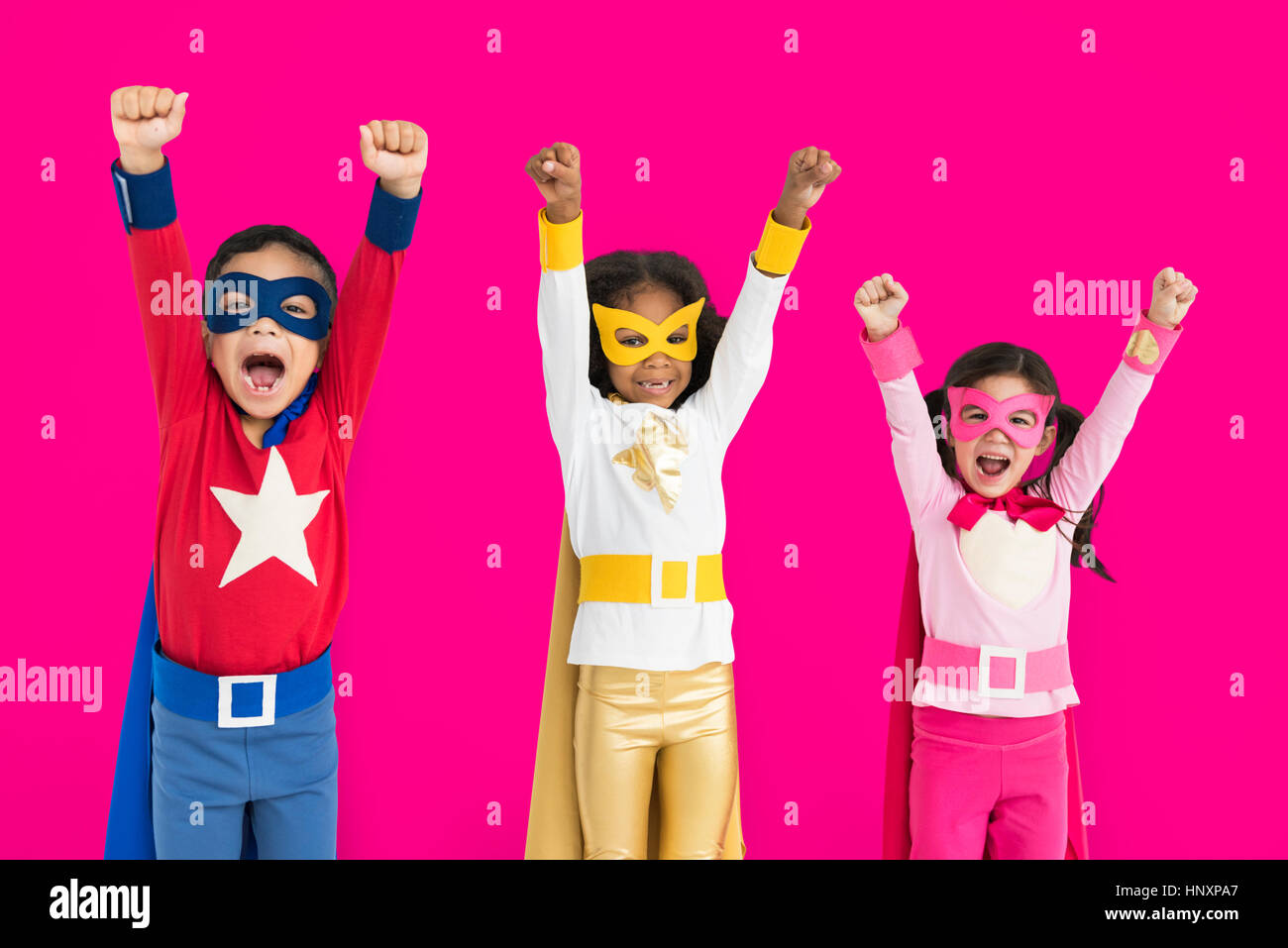 Superhero Kids Hands Up Flying Concept Stock Photo - Alamy