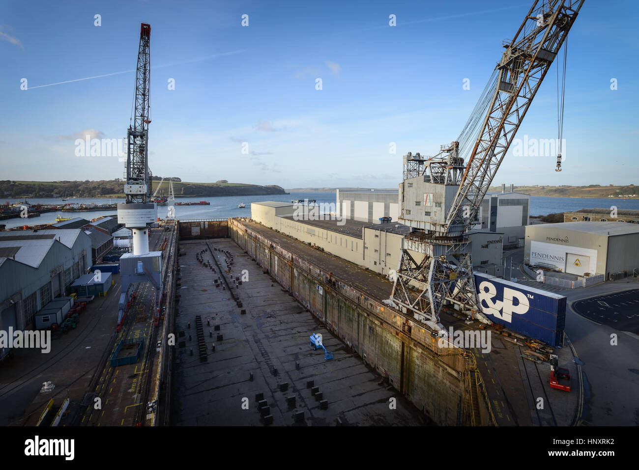 Large cranes next to a empty dry dock and Falmouth Dock in Cornwall ...