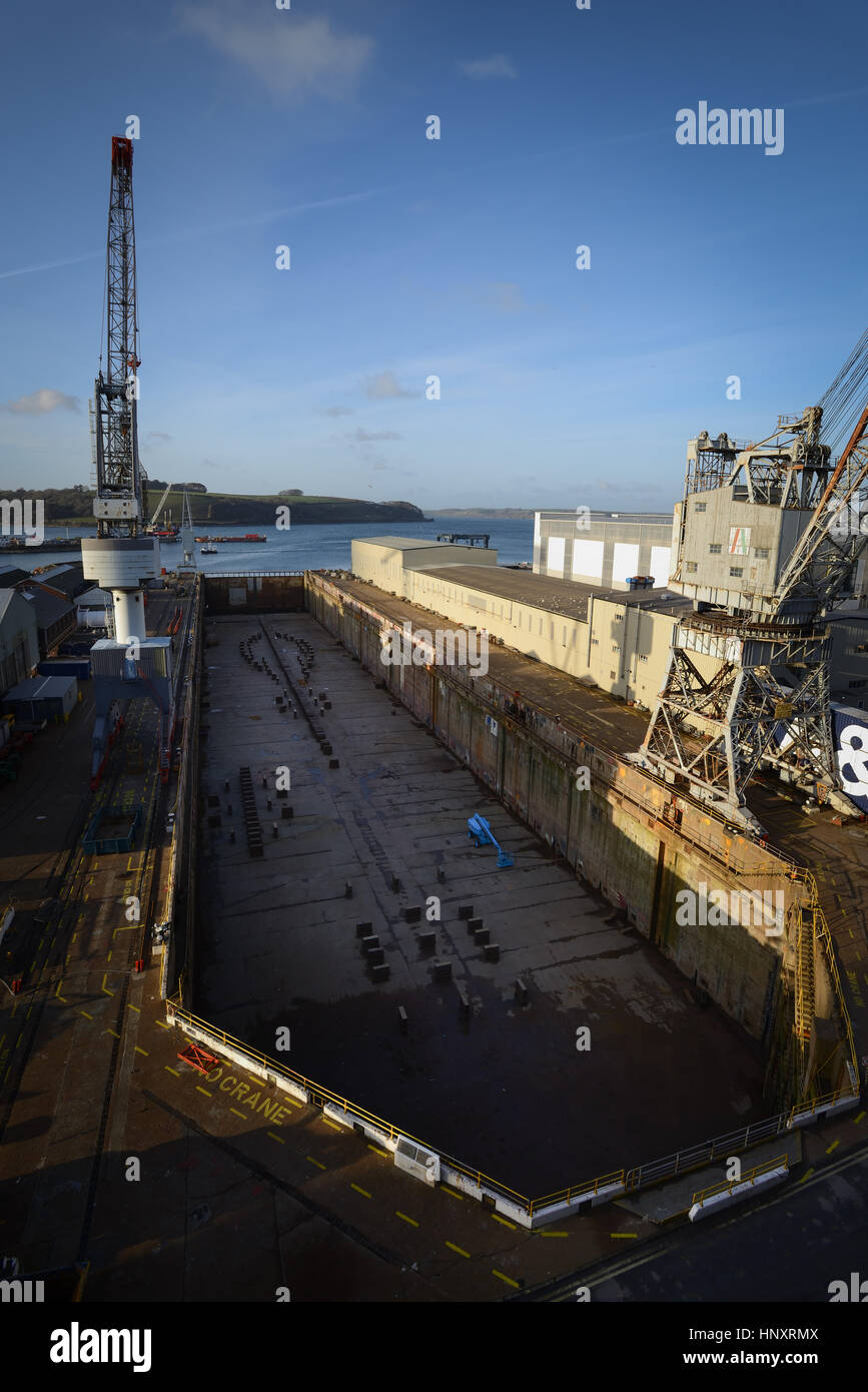 Large cranes next to a empty dry dock and Falmouth Dock in Cornwall ...