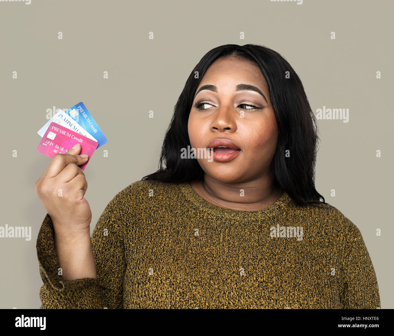 African american woman holding credit hi-res stock photography and ...