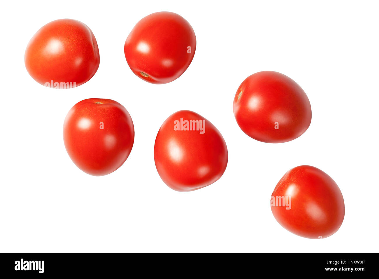 Falling plum tomatoes isolated on white background. Top view Stock ...