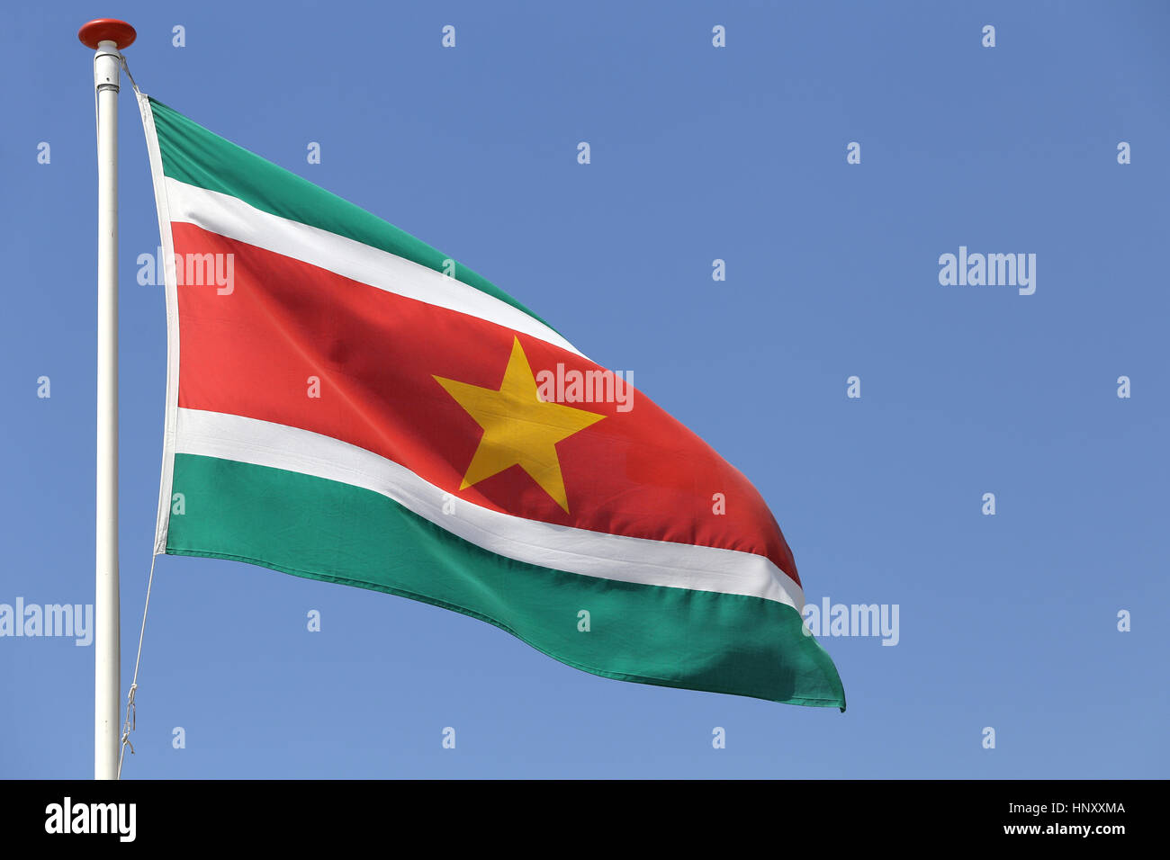 Surinamese flag flying in the wind Stock Photo - Alamy