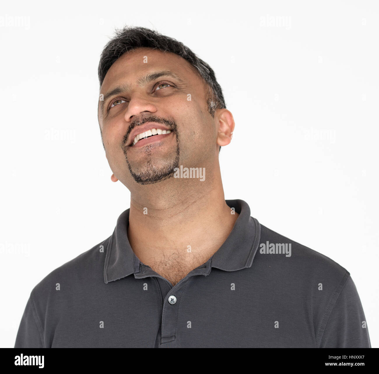 Indian guy smiling cheerful studio portrait Stock Photo - Alamy