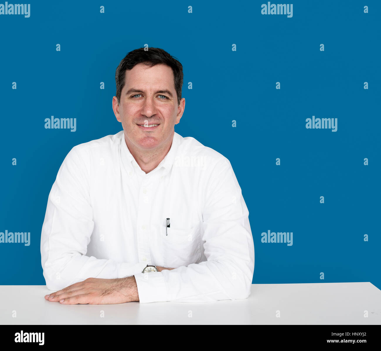 Adult Men Hands On Table Smile Studio Stock Photo - Alamy