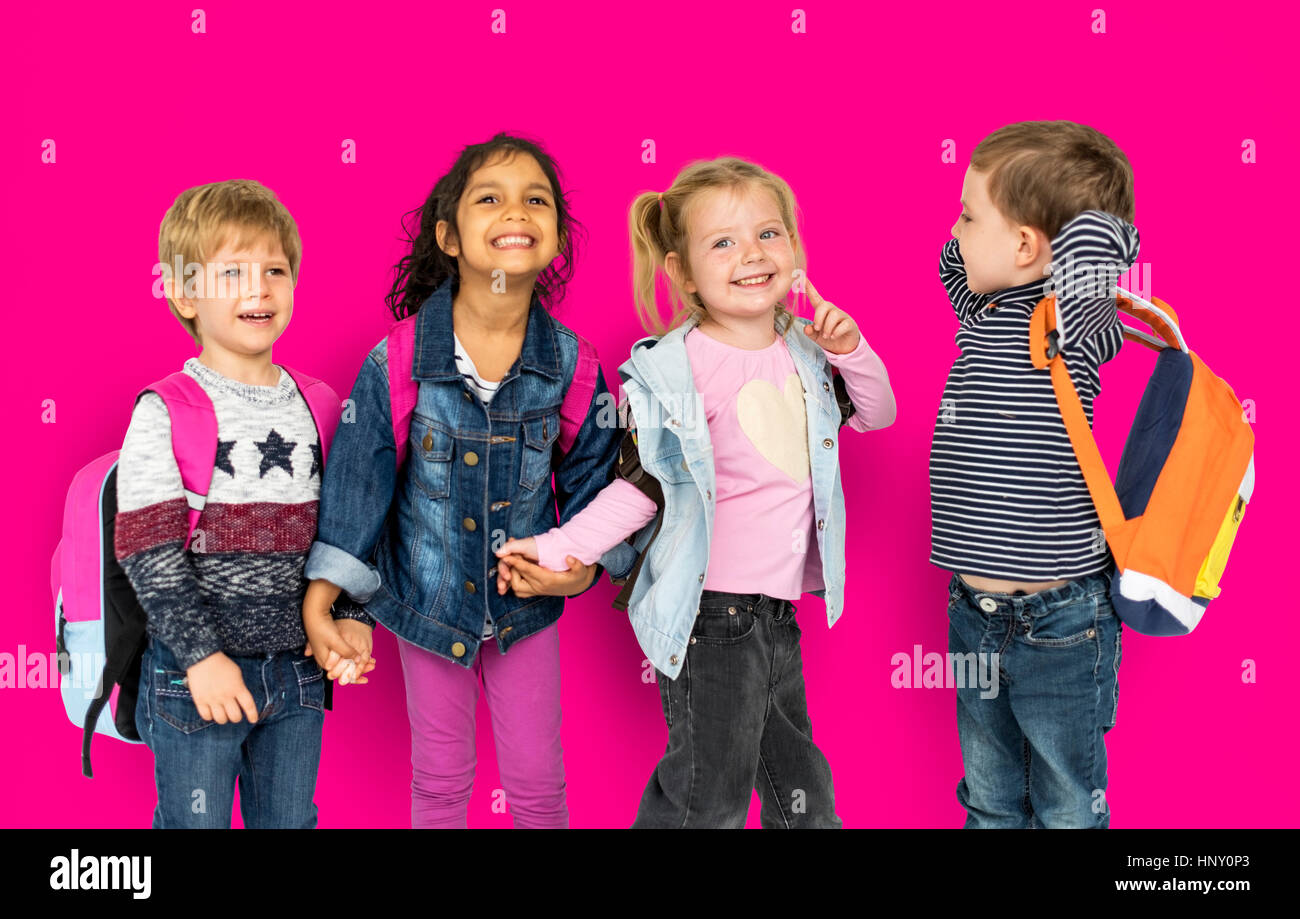 Little Kids Holding Hands Carrying Backpacks Stock Photo - Alamy