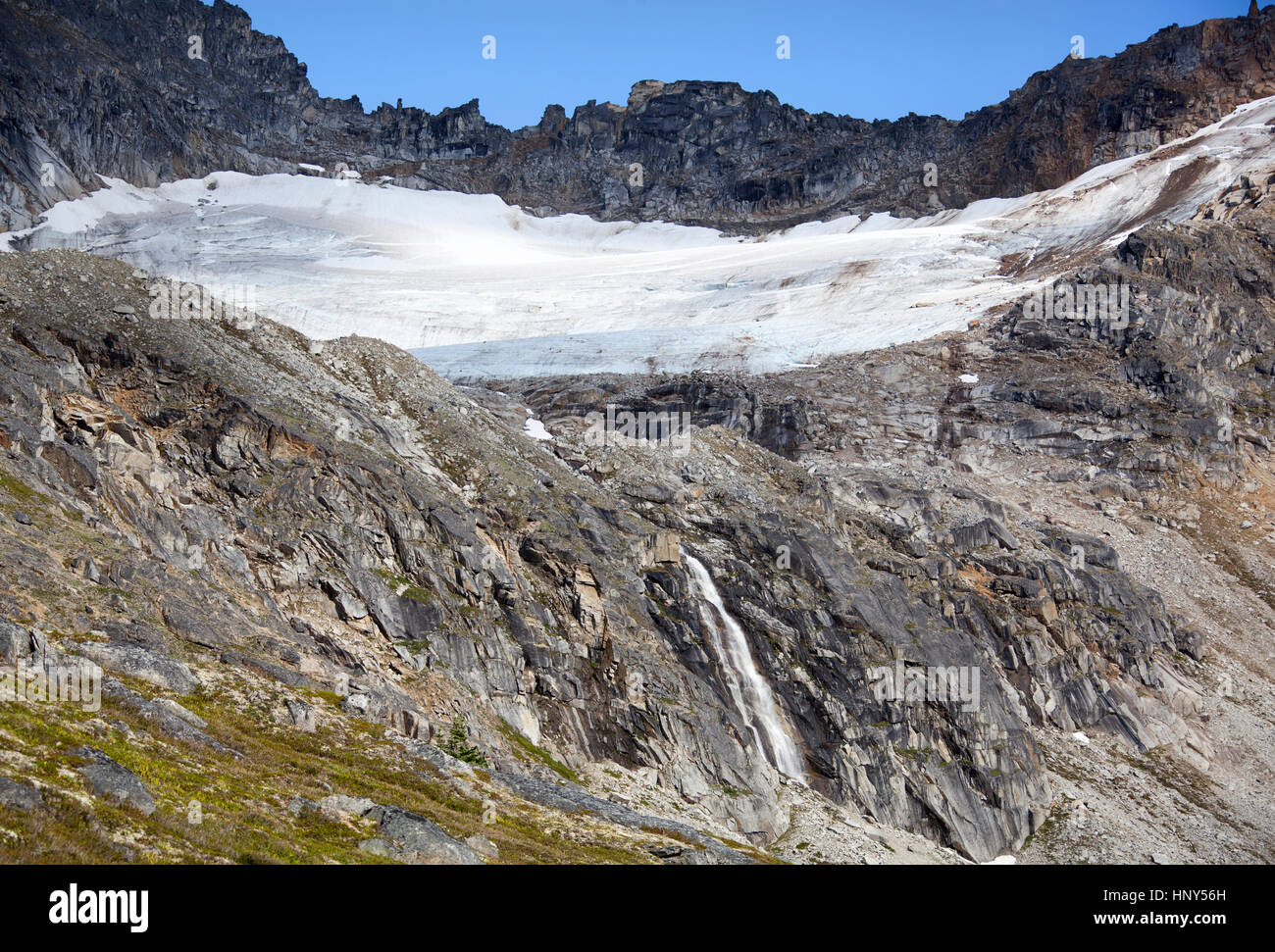 The top of Devil's Punchbowl with a waterfall and unmelted snow in late ...