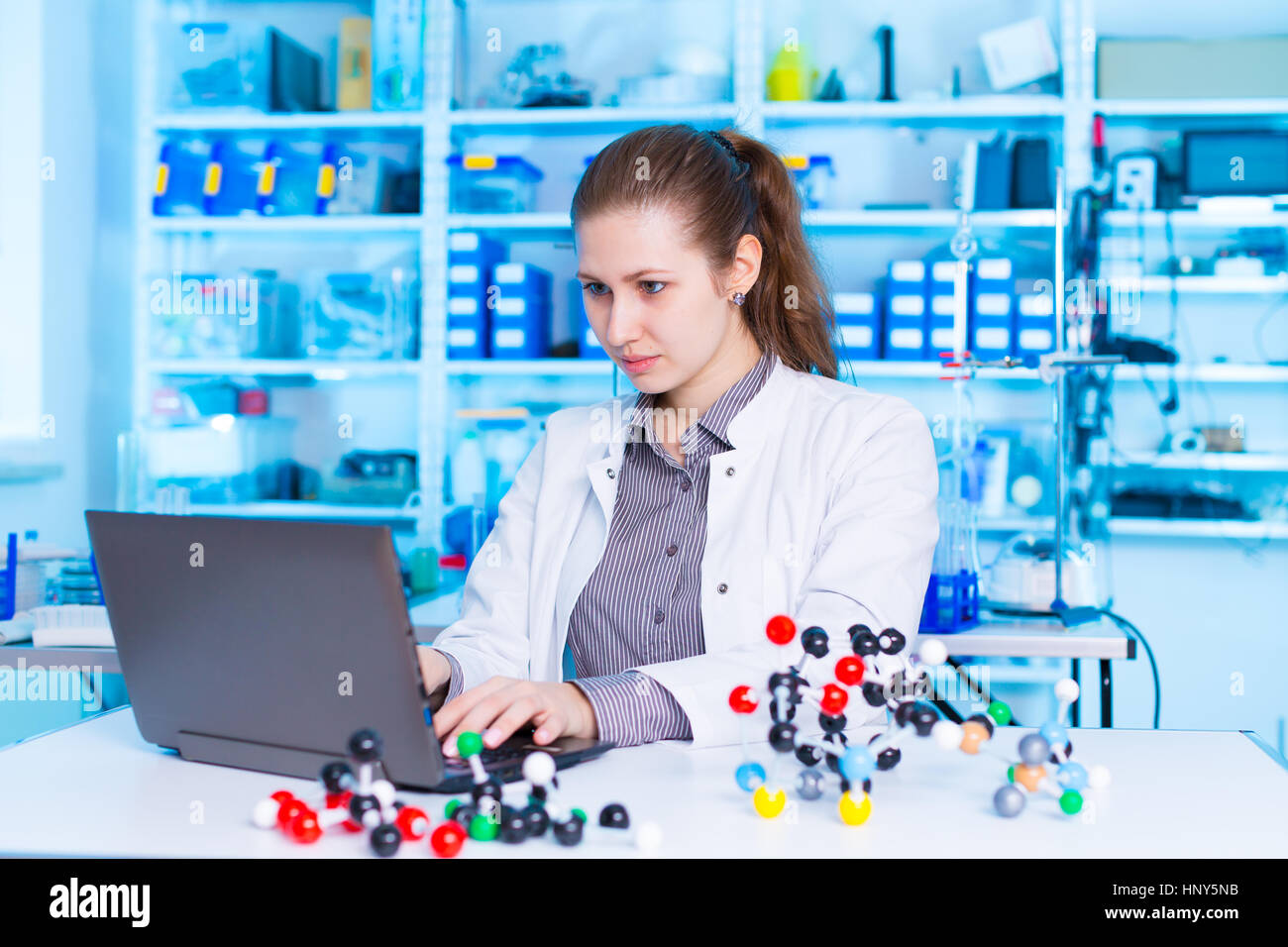 Woman scientist holding model of molecule or crystal lattice. scientist ...