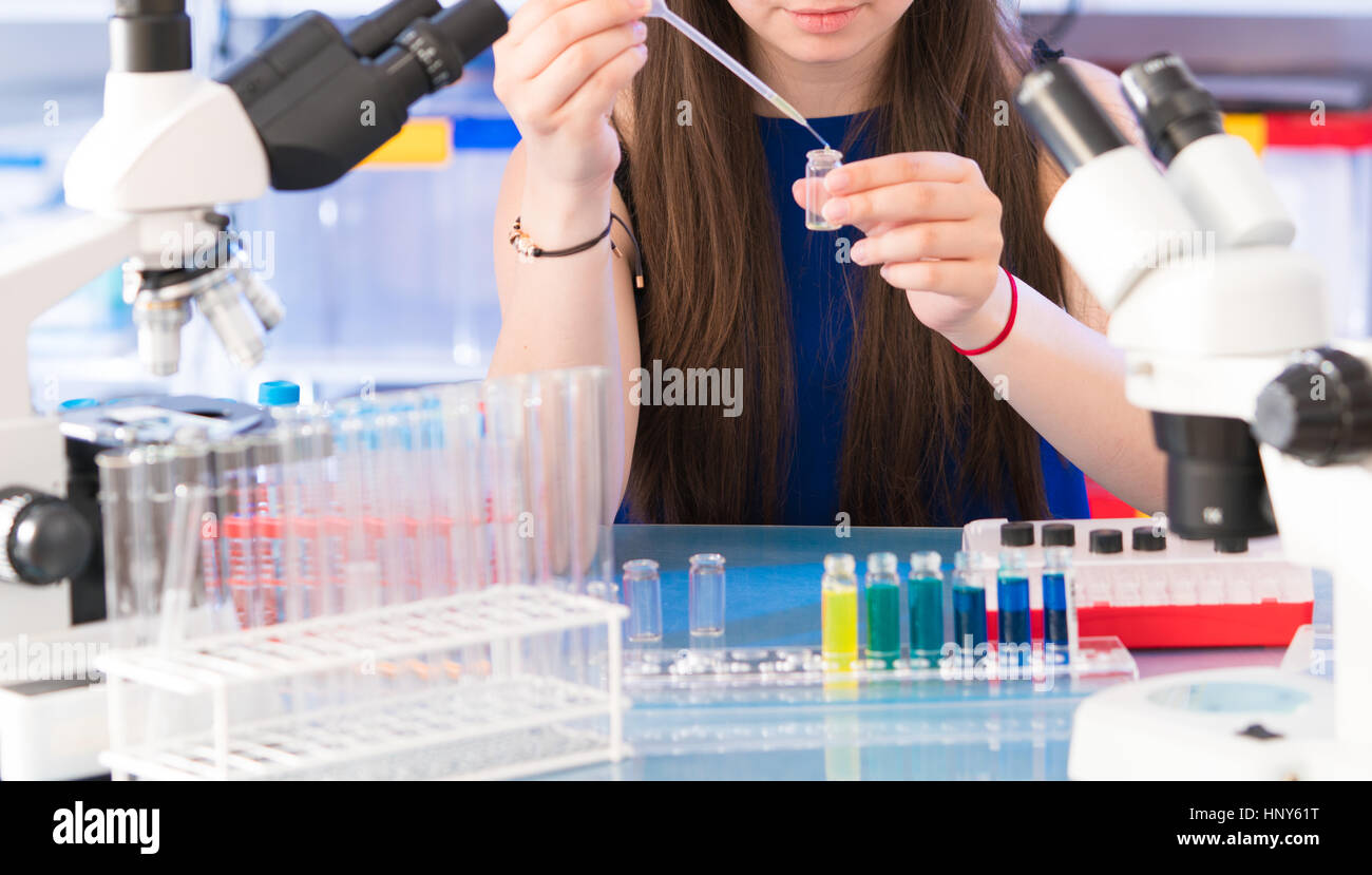 Girl in chemical class, science lesson Stock Photo - Alamy