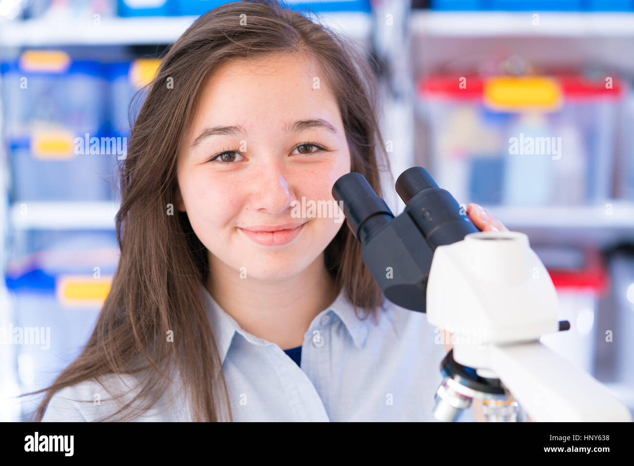 Student girl in microbiological class. Researsh in science laboratory ...
