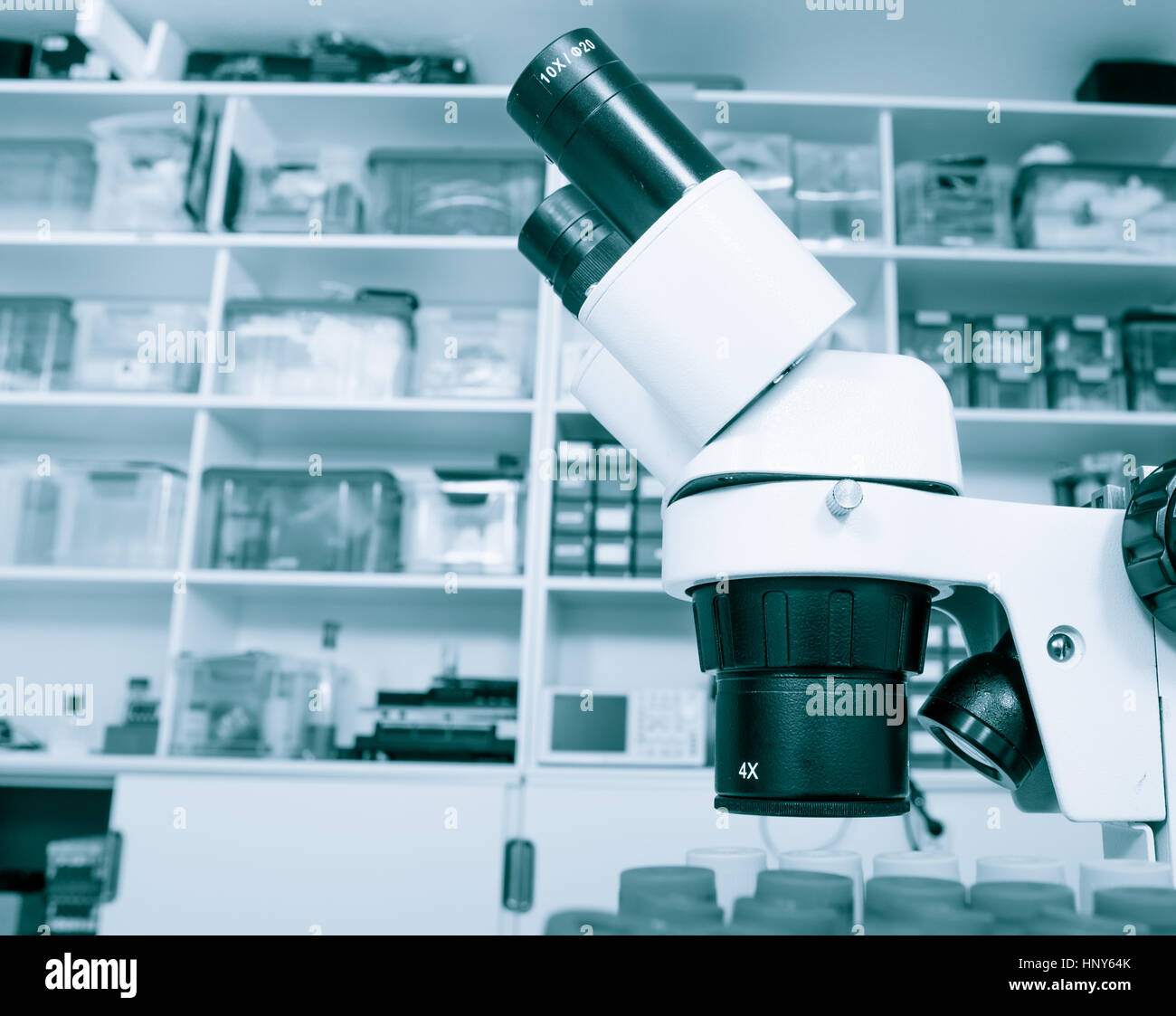 Science laboratory with a microscope, biological material samples and a ...