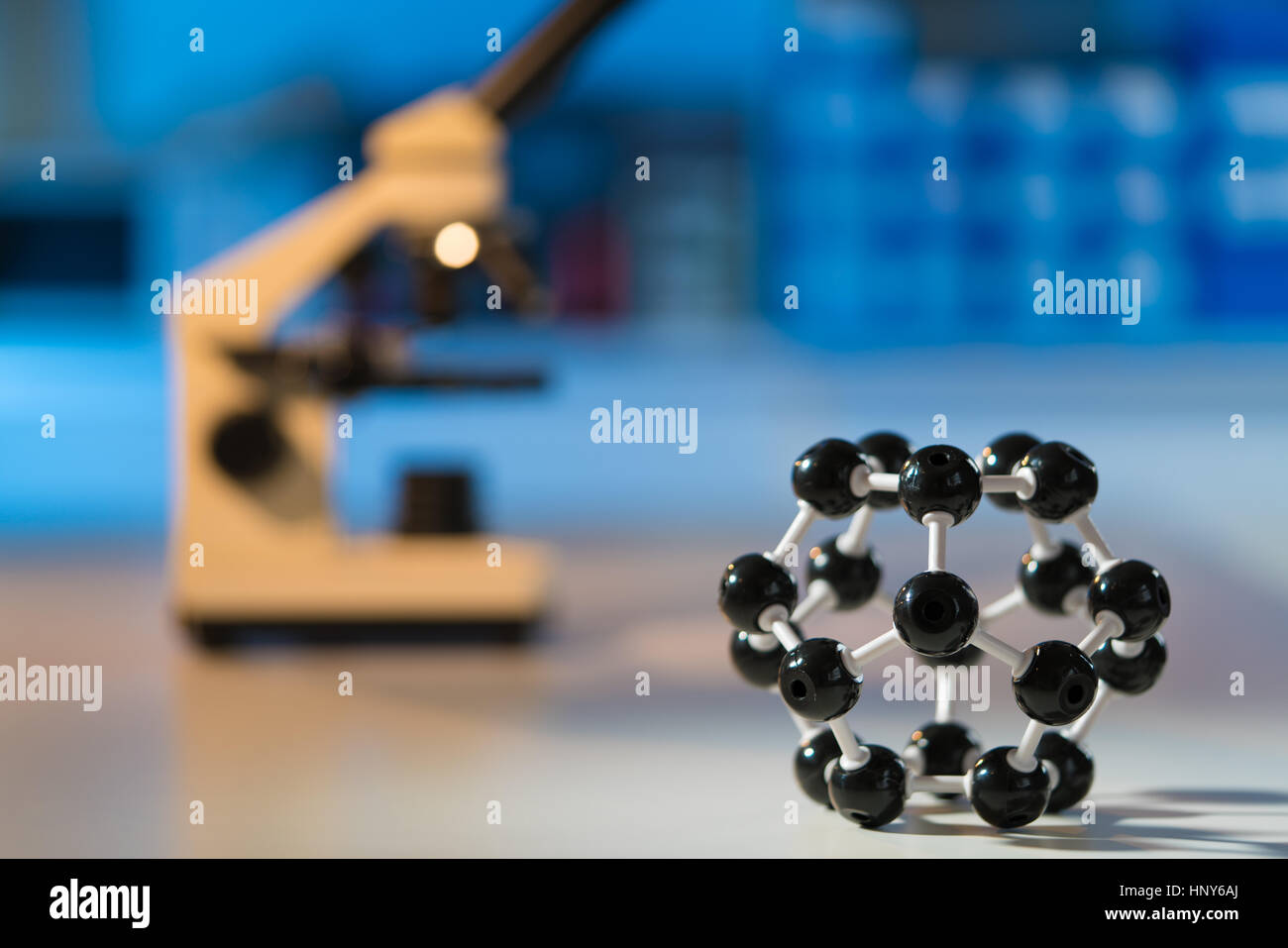 Model of molecule and microscope Stock Photo - Alamy