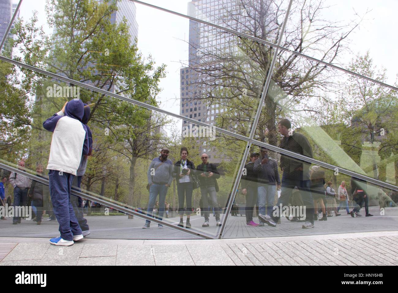 People reflected on a glass building Stock Photo - Alamy