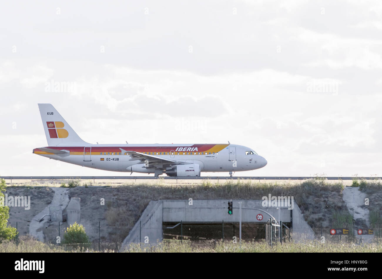 Plane Airbus A319, of Iberia airline, over the runway, ready to take ...