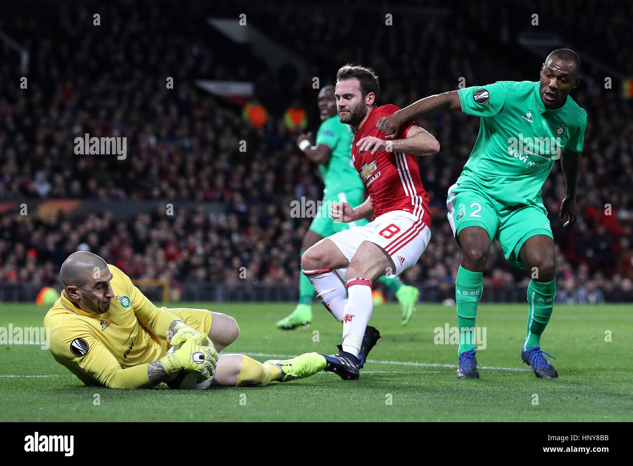 Saint Etienne's Stephane Ruffier (left) saves at the feet of Manchester ...