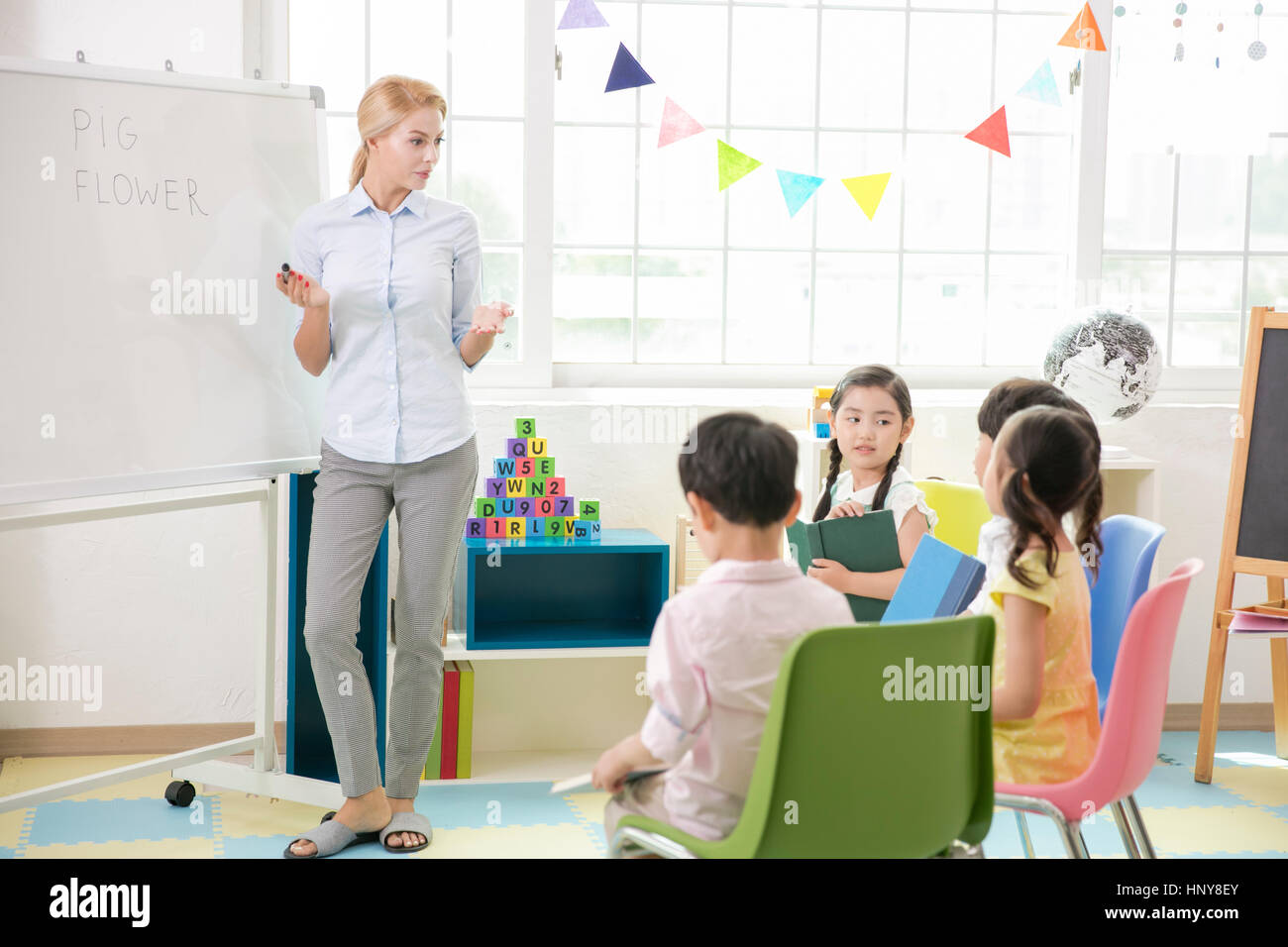 Teacher writing class hi-res stock photography and images - Alamy
