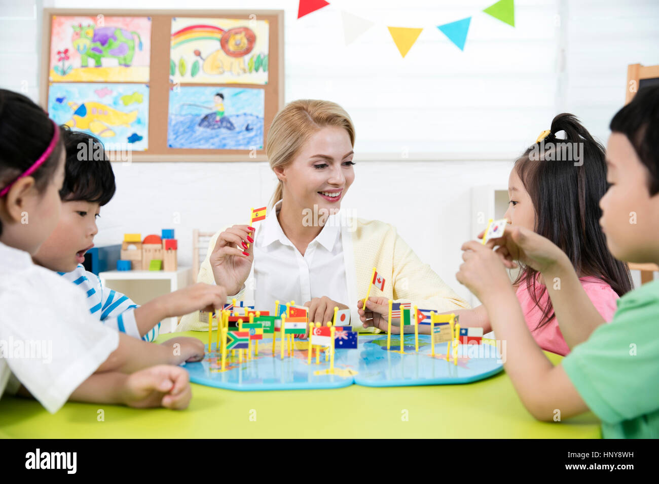 Kindergarten class with foreign teacher Stock Photo - Alamy