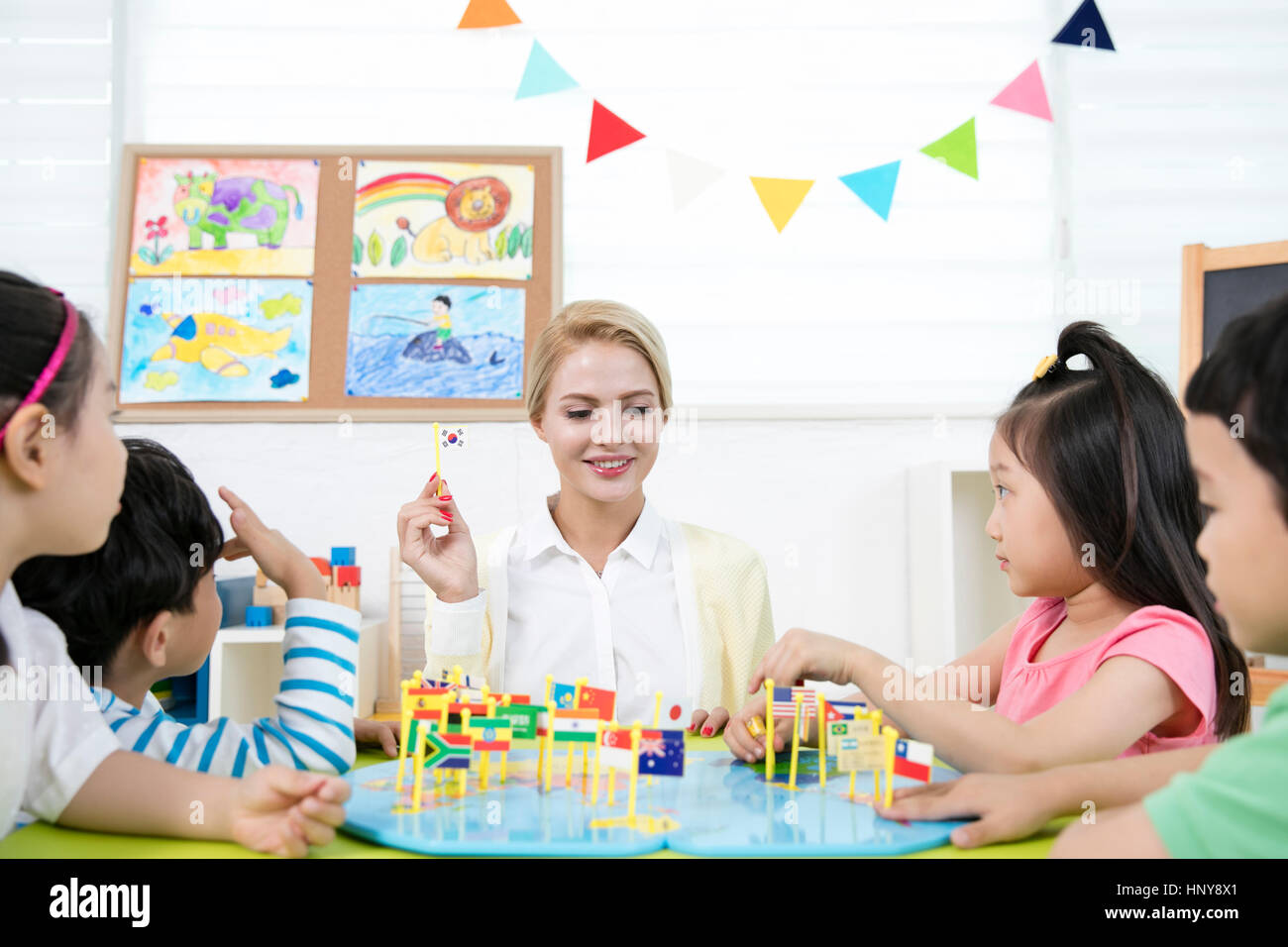 Kindergarten class with foreign teacher Stock Photo - Alamy