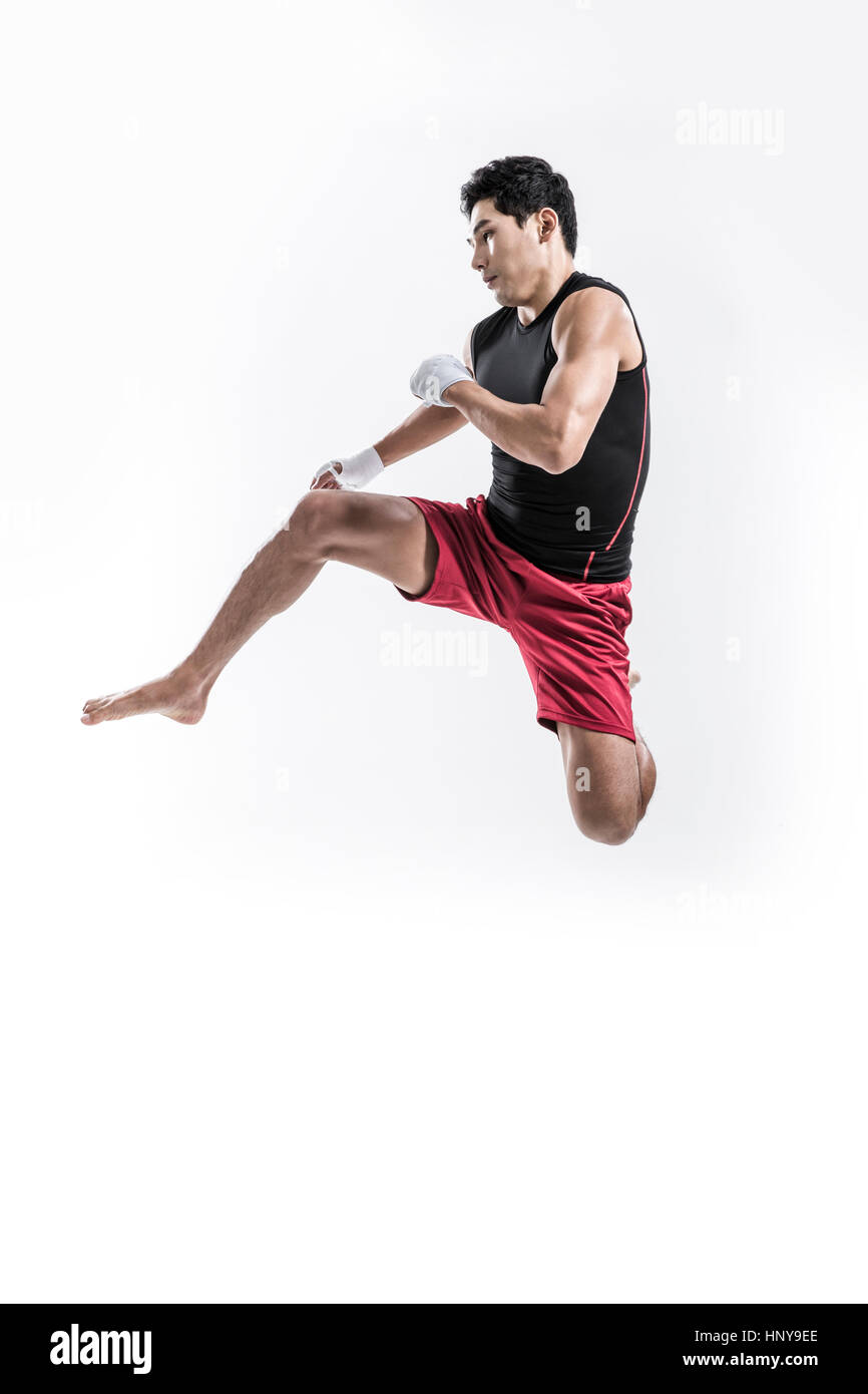 Dynamic kickboxer jumping Stock Photo - Alamy